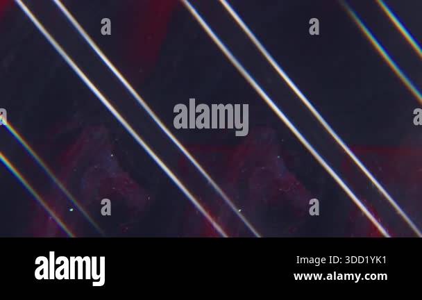 Ink angle. Vibrant wet texture. Defocused red purple neon color glitter ...