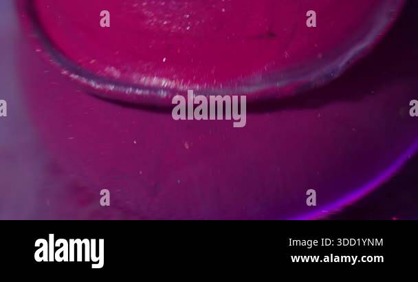 Shiny ink drop. Blurred fluid blend. Pink black liquid spill on purple ...