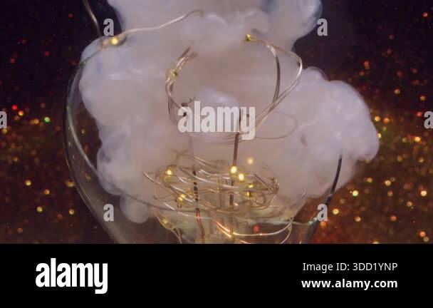 Ink cloud. Defocused garland illumination. White smoke color paint ...