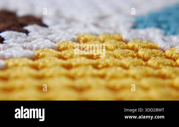 This shows a close-up of a colorful crochet pattern made by hand Stock ...