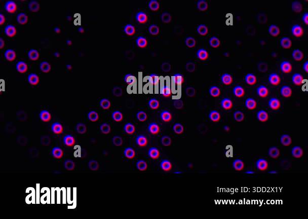 Vibrant pink and blue dots scattered across a dark background, creating ...