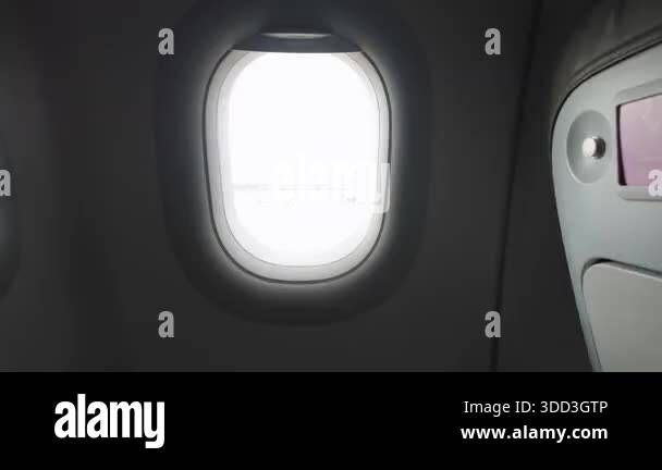 Plane window view transitions to full tarmac scene with aircraft ...
