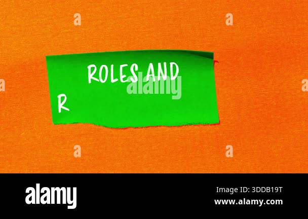 Roles and responsibilities message writing on ripped torn paper ...