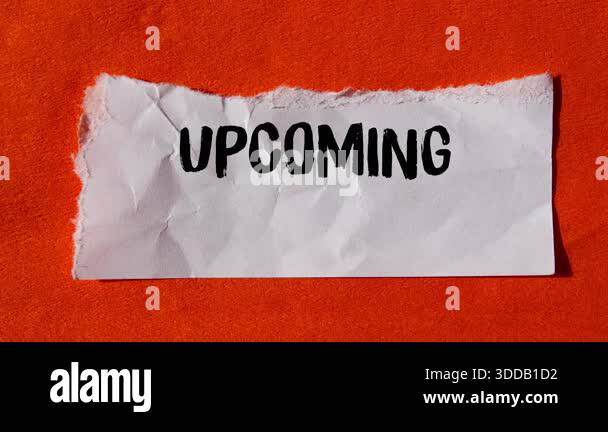 Upcoming events message writing on ripped torn paper background Stock ...