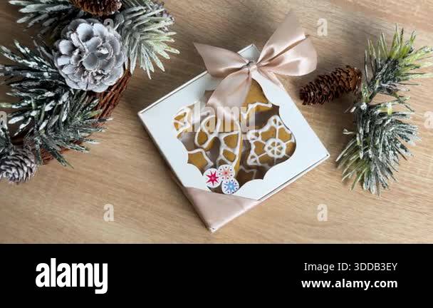 Christmas gingerbread cookies in a festive gift box on a wooden table ...