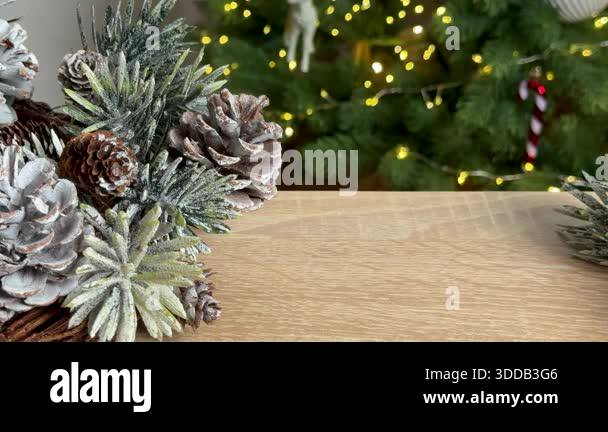 Hand placing a gift box with homemade gingerbread cookies on a table ...