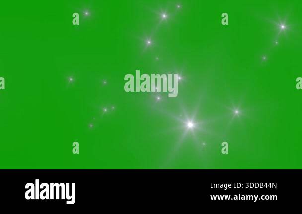 White sparkling dust and glowing star particles animated on green ...