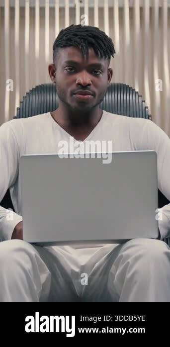 Futurism serious African American man with laptop shaking finger no ...