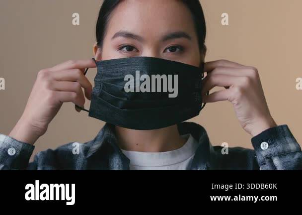 Korean woman wear black medical face mask indoors protecting health ...