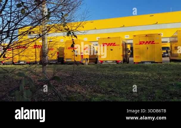 Yellow electric delivery vehicles of the German postal service are ...