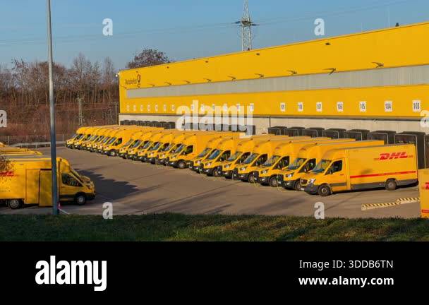 Yellow electric delivery vehicles of the German postal service are ...