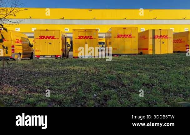 Yellow electric delivery vehicles of the German postal service are ...