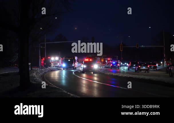 Nighttime scene of multiple emergency vehicles responding at an ...