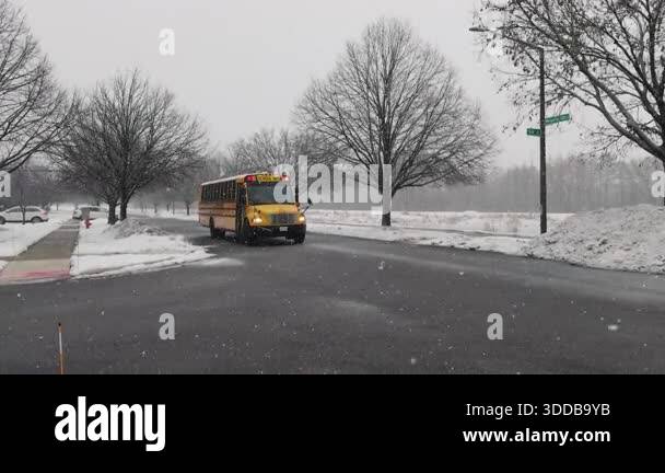 Yellow school bus stopping at suburban neighborhood during active ...