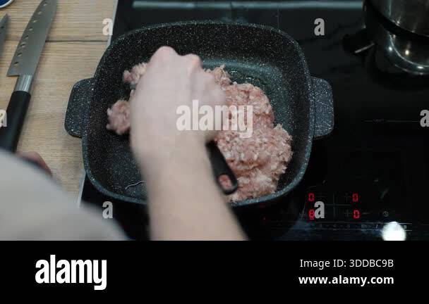 Male hand cooking ground meat with this comprehensive visual guide ...