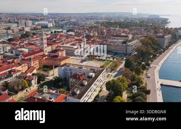 Aerial drone view of Zadar's waterfront and historic Old Town, with St ...