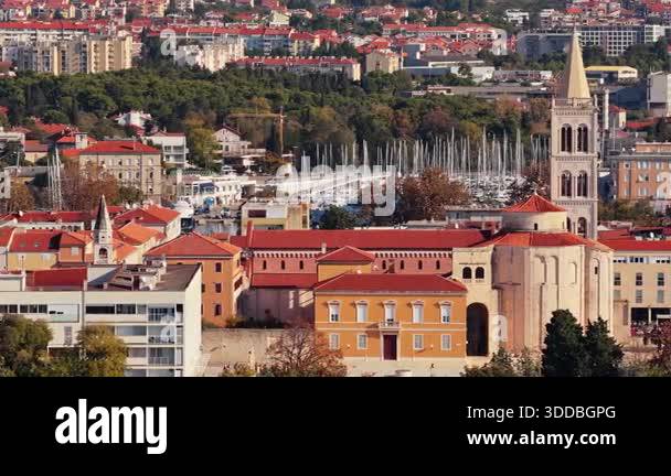 Aerial drone view of Zadar's waterfront and historic Old Town, with St ...