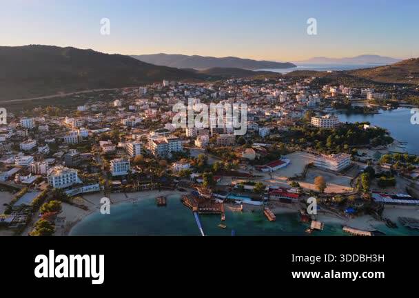 Aerial drone view of Ksamil town, its dense cluster of hotels and ...