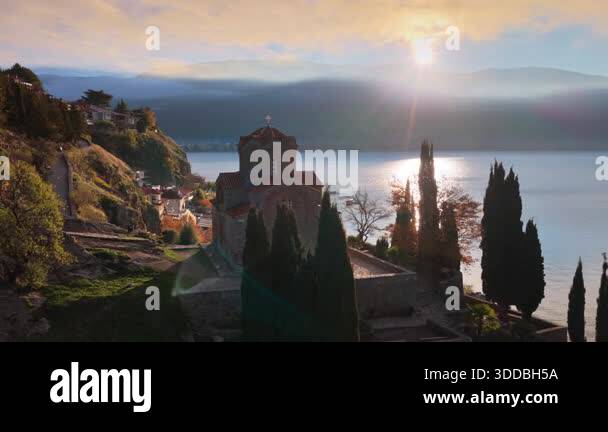 Aerial drone view of a sunrise scene behind St. John at Kaneo, with ...