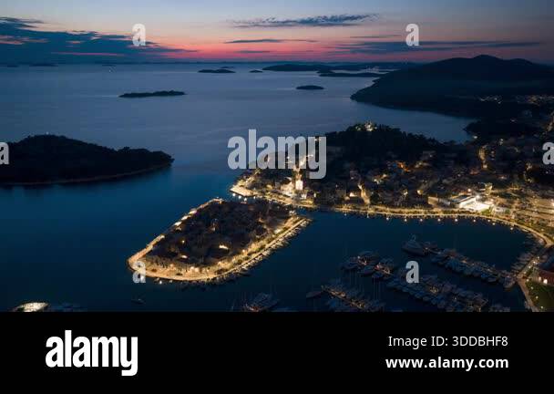 Aerial drone timelapse of Tribunj, Croatia at night, red sky at dawn ...