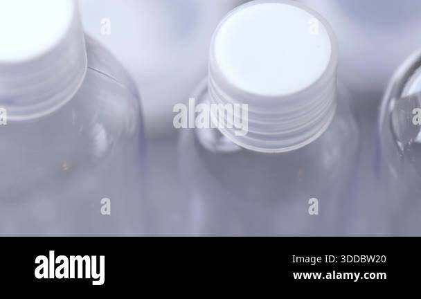 A slow panning shot of travel bottle caps and containers placed on a ...