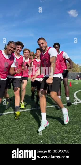 Diverse group of male athletes celebrating a victory. Joyful football ...
