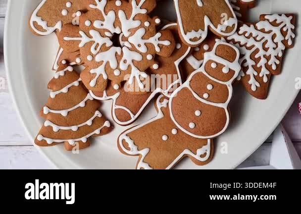 Holiday background. Christmas gingerbread cookies with icing in a plate ...