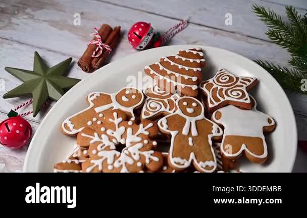 Holiday background. Christmas gingerbread cookies with icing in a plate ...