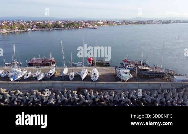 A small sea fishing port with boats in the calm deep cool Black Sea ...