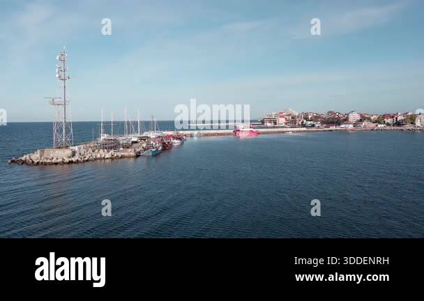 A small sea fishing port with boats in the calm deep cool Black Sea ...