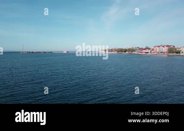 A small sea fishing port with boats in the calm deep cool Black Sea ...