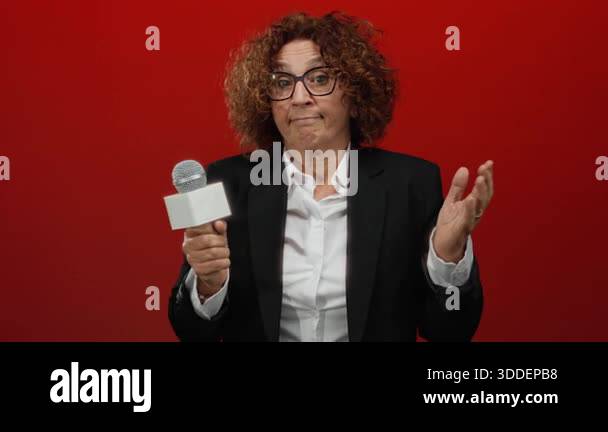 Brunette hispanic woman reporter with microphone stands against an ...