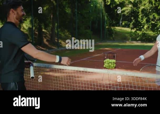 Close up players man and woman handshake each before play tennis on ...