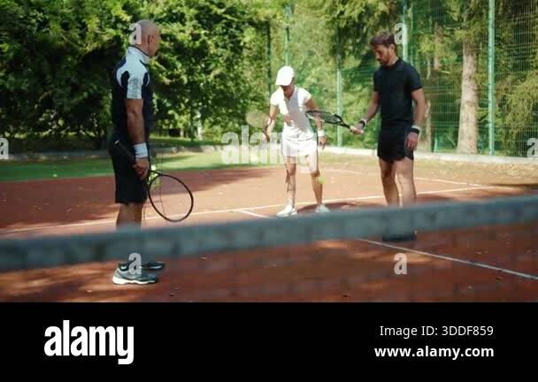 Close up coach teaching play tennis man and woman outdoor sports ...
