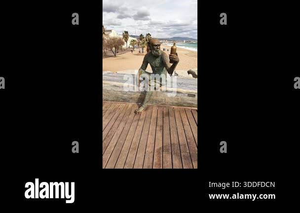 Famous Anis del Mono monkey statue on the promenade with factory ...