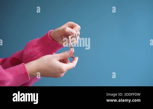 Detailed macro footage of hands locking heart shaped padlock ...