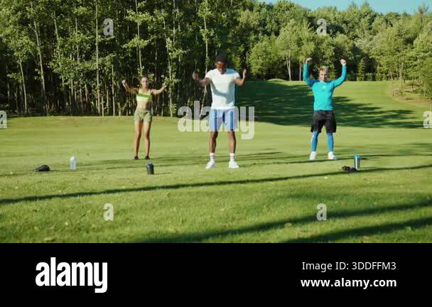 Multi-ethnic sports team of healthy-looking athletes warming up ...