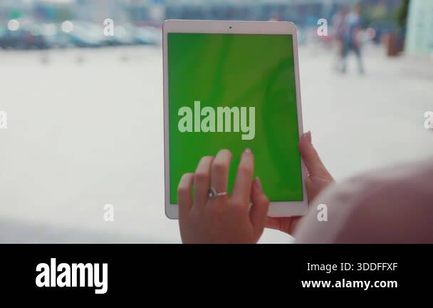 Girl browsing in social network on tablet computer tapping on mock-up ...