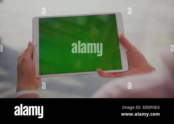 Female hands showing horizontal tablet digital computer with ...