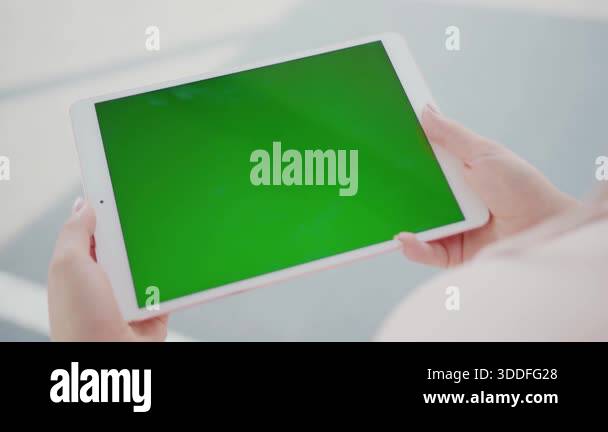 Close-up young woman hands holding modern blank tablet with mock up ...