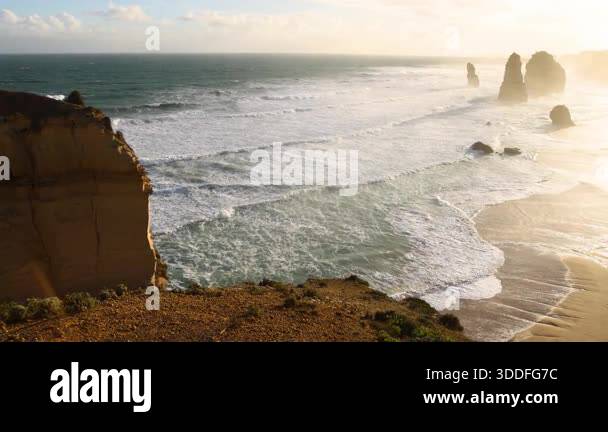 Waves crashing against iconic limestone stacks Stock Video Footage - Alamy