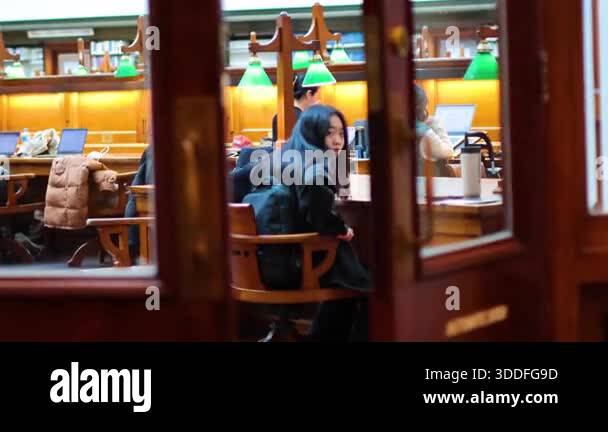 People entering through automatic doors at library Stock Video Footage ...