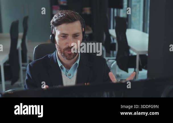 Face happy man uses headphone for work speaking on computer smiling in ...