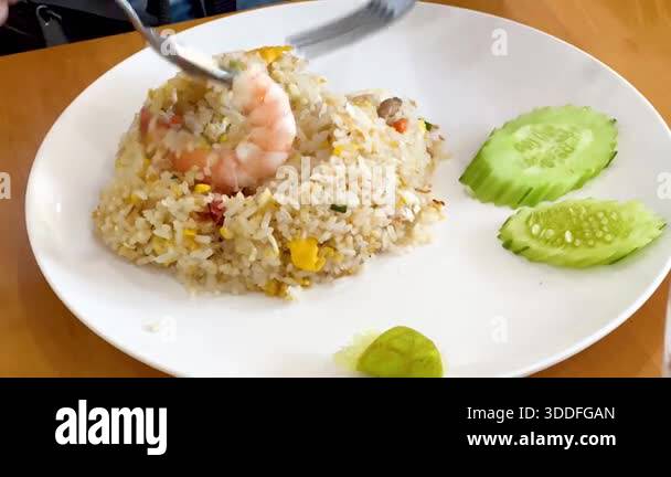 Delicious shrimp fried rice with fresh cucumbers Stock Video Footage ...