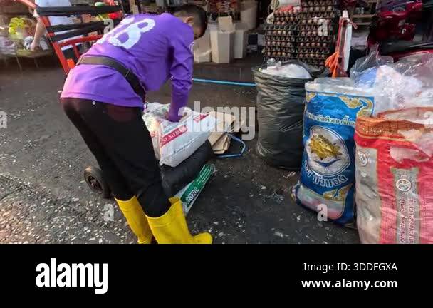 Person sorting recyclables into designated bags Stock Video Footage - Alamy
