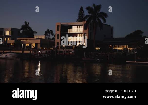 Time-lapse of evening light over waterfront buildings Stock Video ...