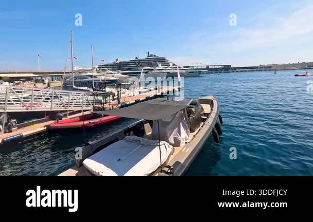 Boats and yachts docked at Monte Carlo pier Stock Video Footage - Alamy