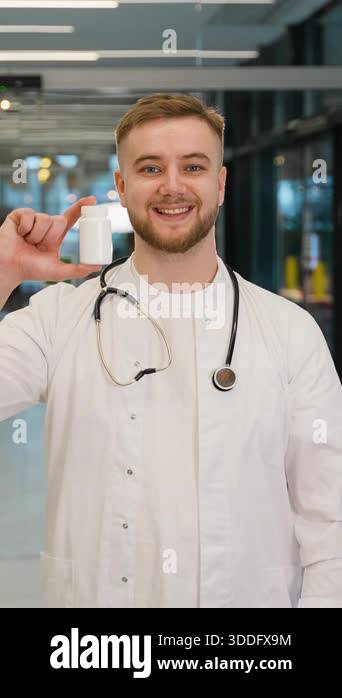 Professional caucasian doctor in a white lab coat with a stethoscope ...