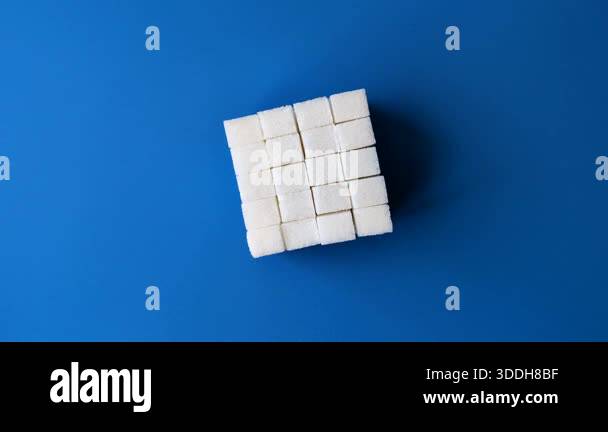 Sweet white sugar cubes as a source of glucose. White sugar cubes as a ...