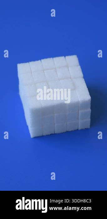 Sweet white sugar cubes as a source of glucose. White sugar cubes as a ...